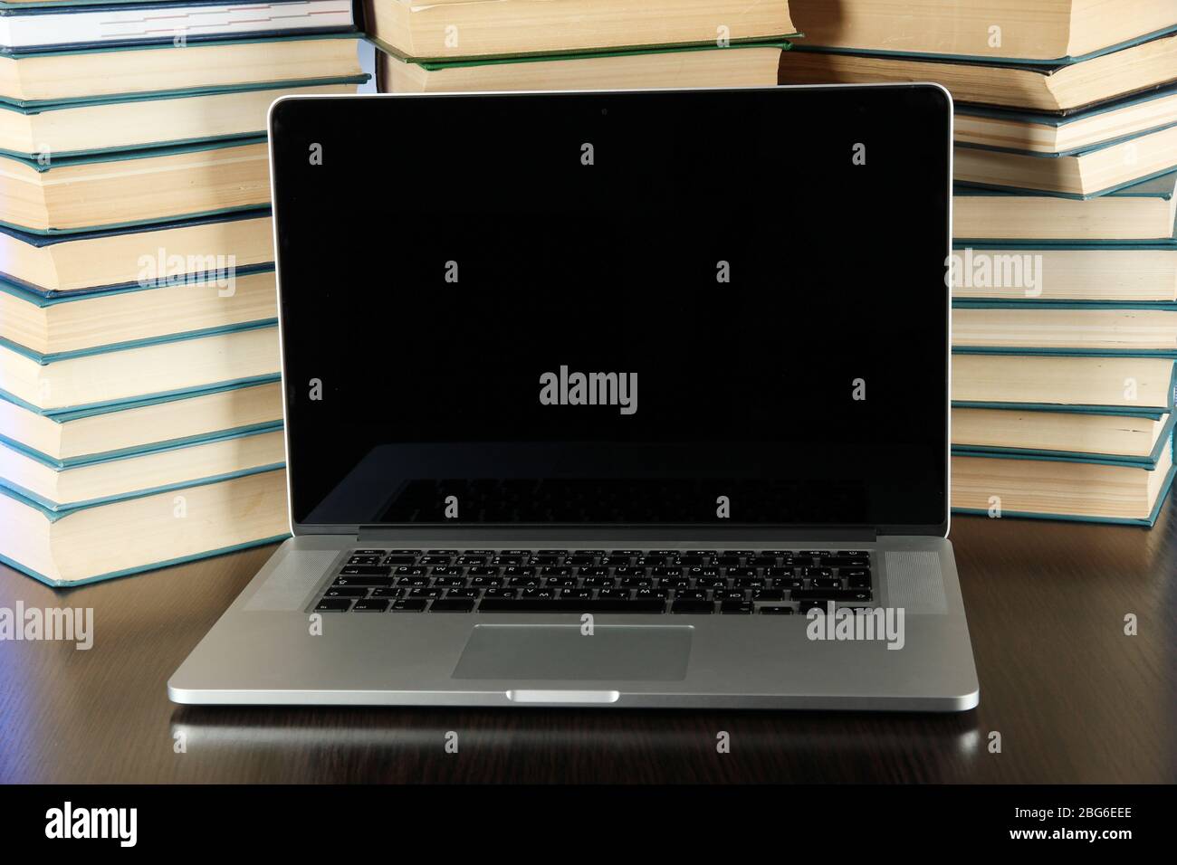 Notebook on books background Stock Photo - Alamy