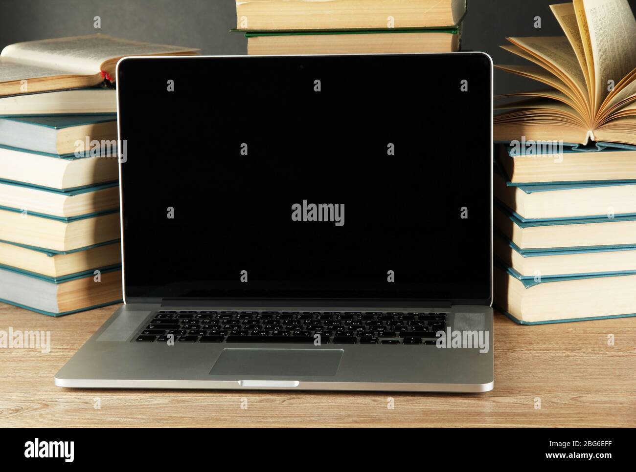 Notebook on books background Stock Photo - Alamy