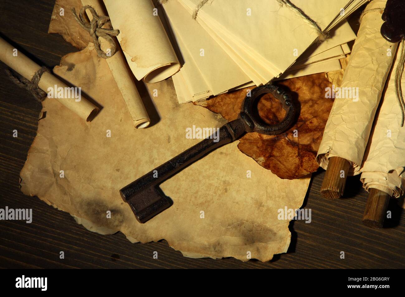 Antique keys and scroll on dark background Stock Photo - Alamy