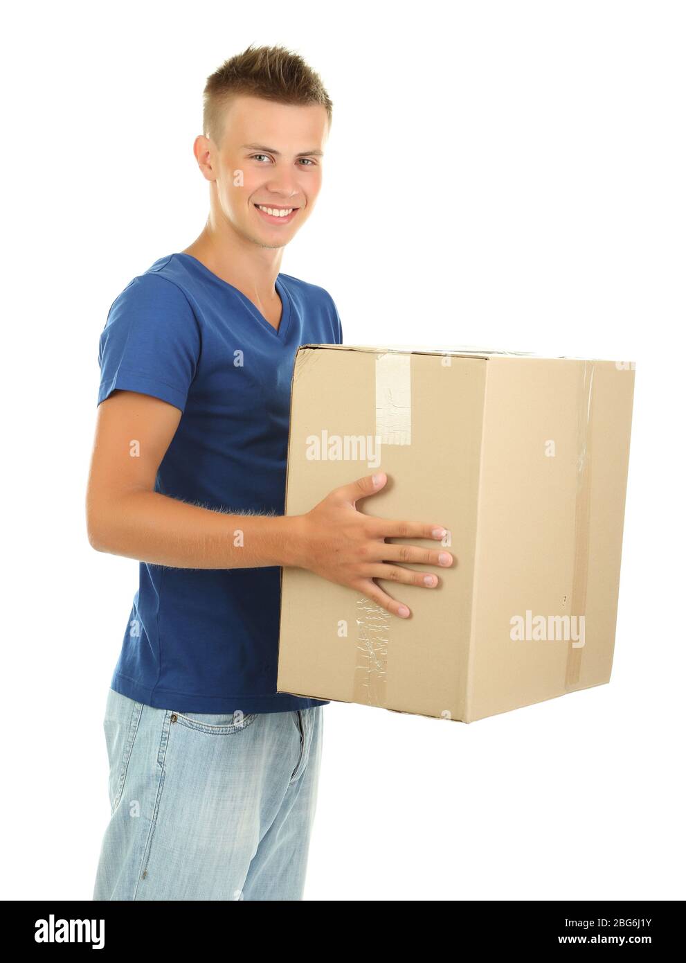 Young delivery man holding parcel, isolated on white Stock Photo - Alamy