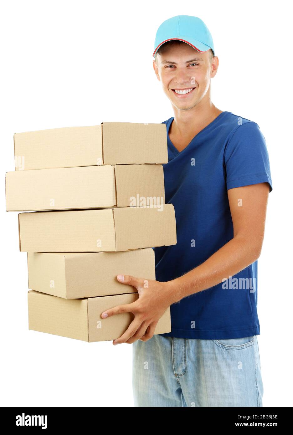Young delivery man holding parcels, isolated on white Stock Photo - Alamy