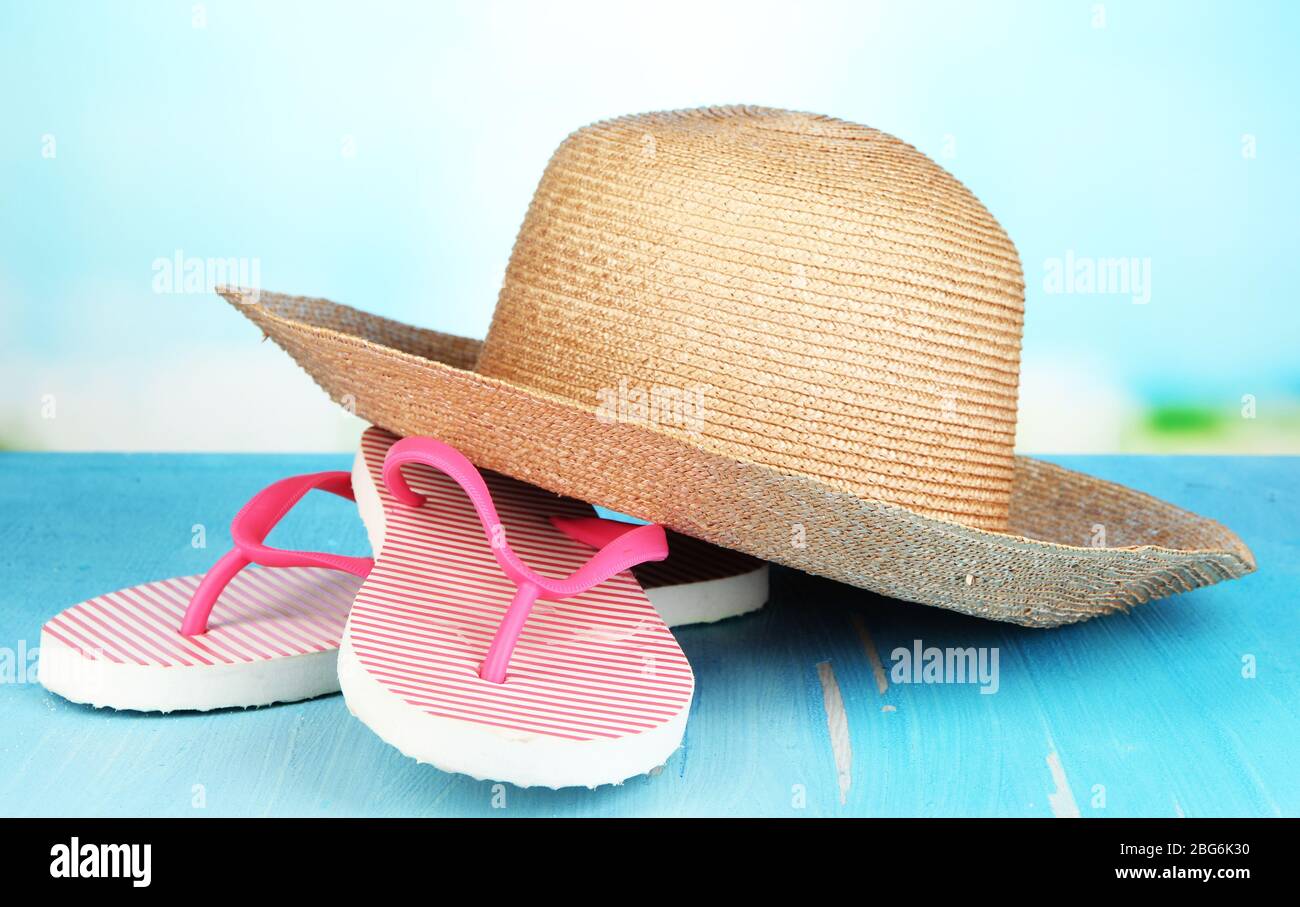 Beach items on beach background Stock Photo - Alamy