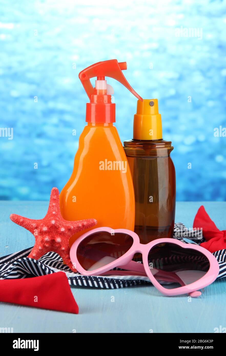 Beach items on beach background Stock Photo - Alamy