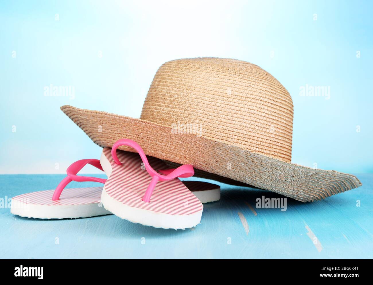 Beach items on beach background Stock Photo - Alamy
