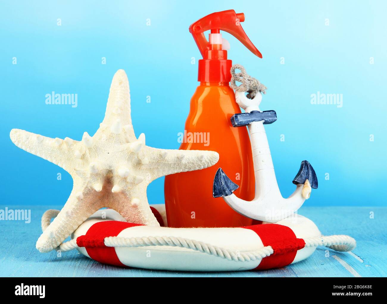 Beach items on beach background Stock Photo - Alamy