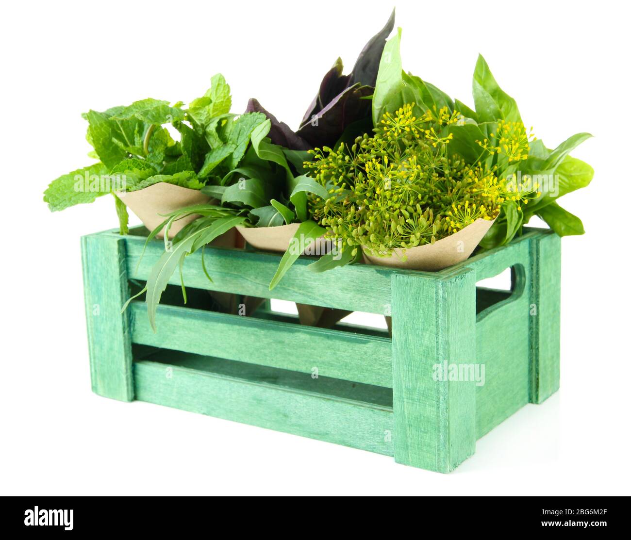 Fresh herbs in wooden crate, isolated on white Stock Photo - Alamy