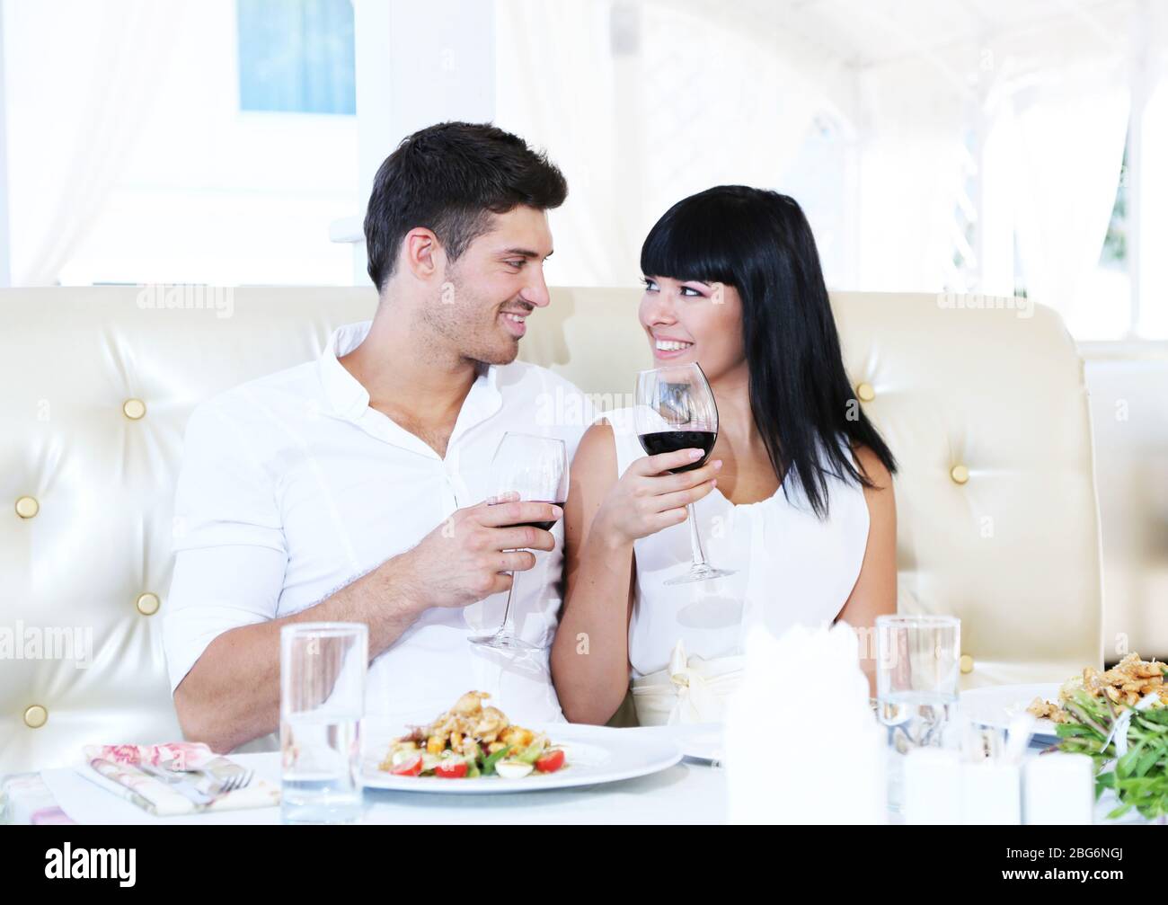 Beautiful couple having romantic dinner at restaurant Stock Photo - Alamy