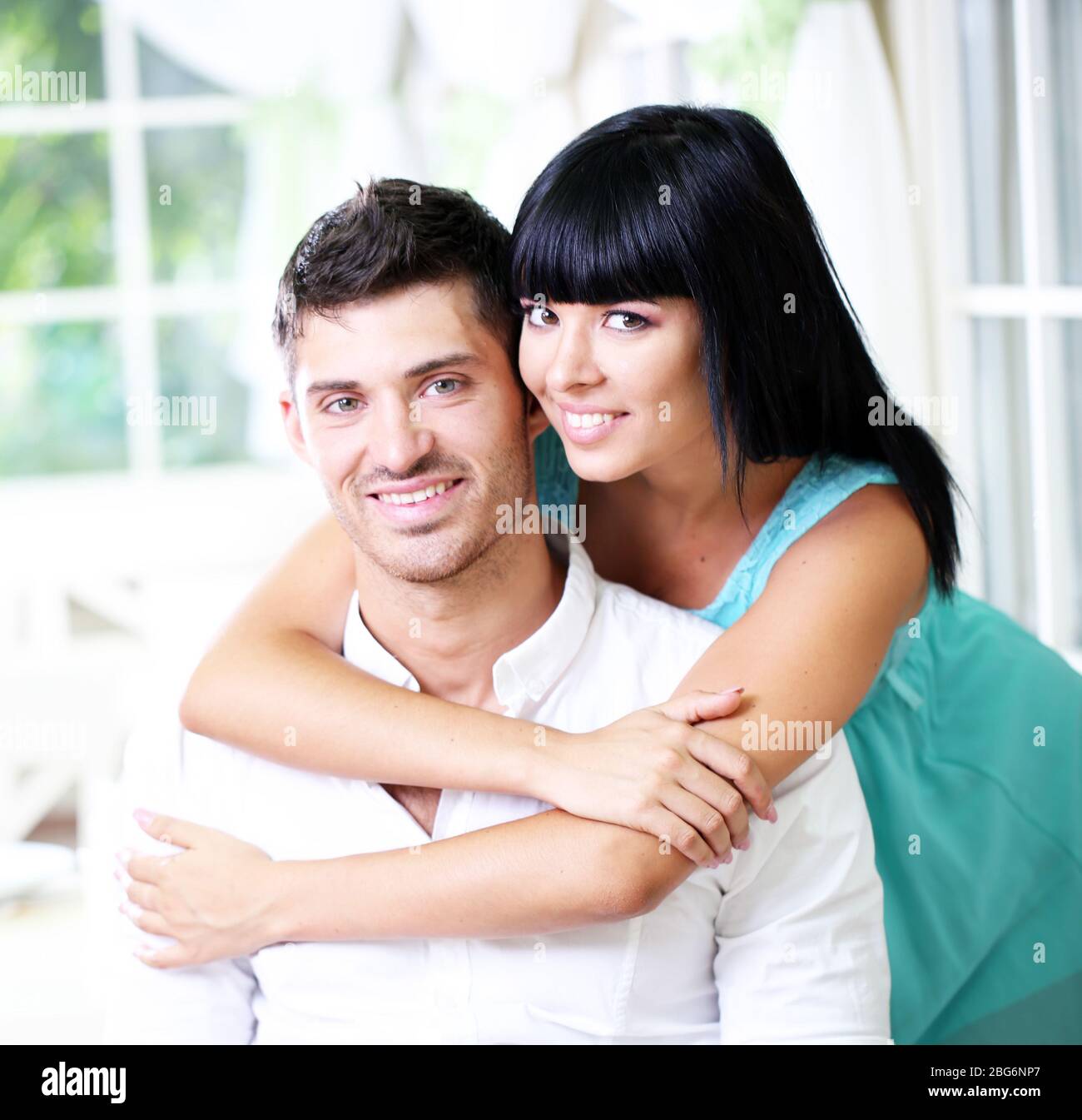 Beautiful young romantic couple in cafe Stock Photo - Alamy