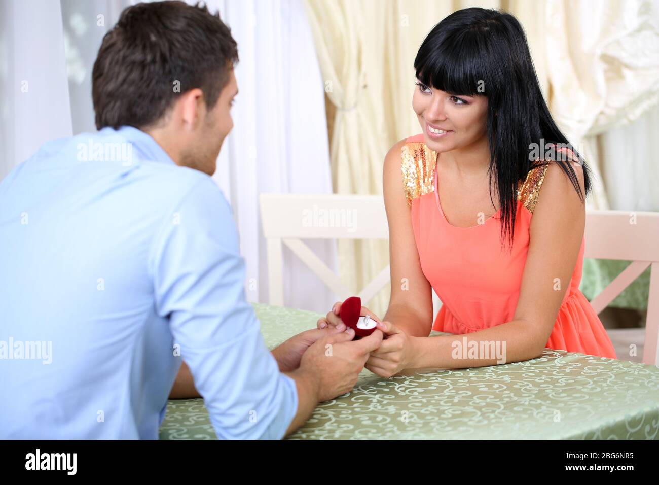 Man proposing engagement ring his woman in restaurant Stock Photo - Alamy