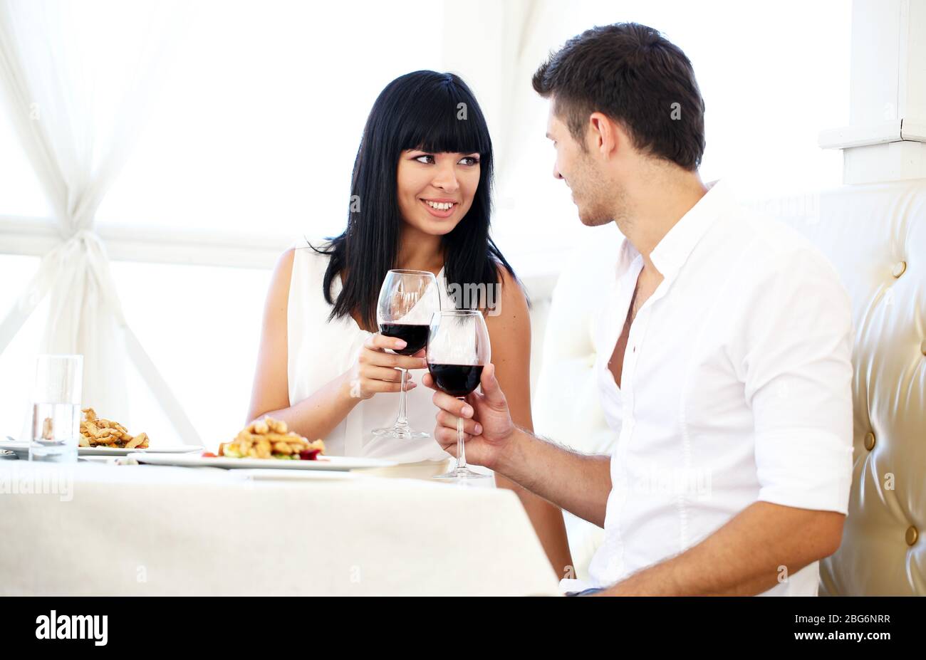 Beautiful couple having romantic dinner at restaurant Stock Photo - Alamy