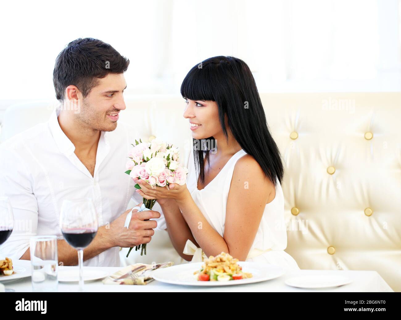 Beautiful couple having romantic dinner at restaurant Stock Photo - Alamy