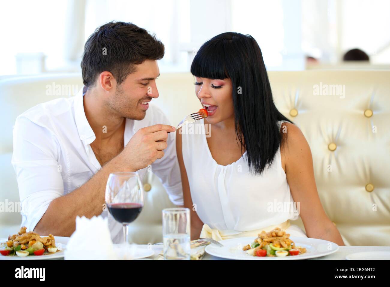 Beautiful couple having romantic dinner at restaurant Stock Photo - Alamy