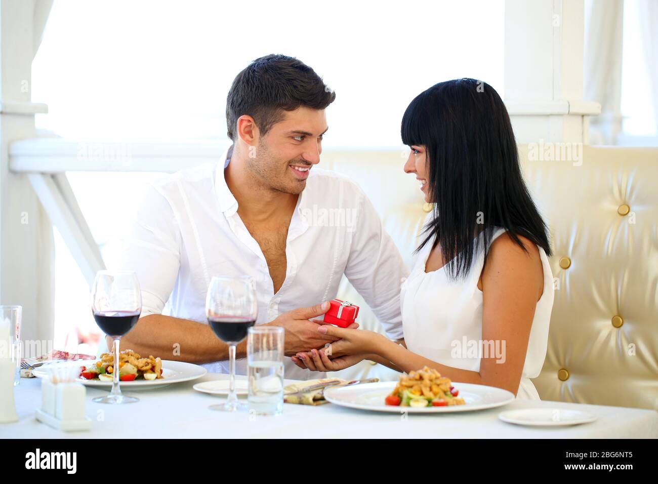 Beautiful couple having romantic dinner at restaurant Stock Photo - Alamy