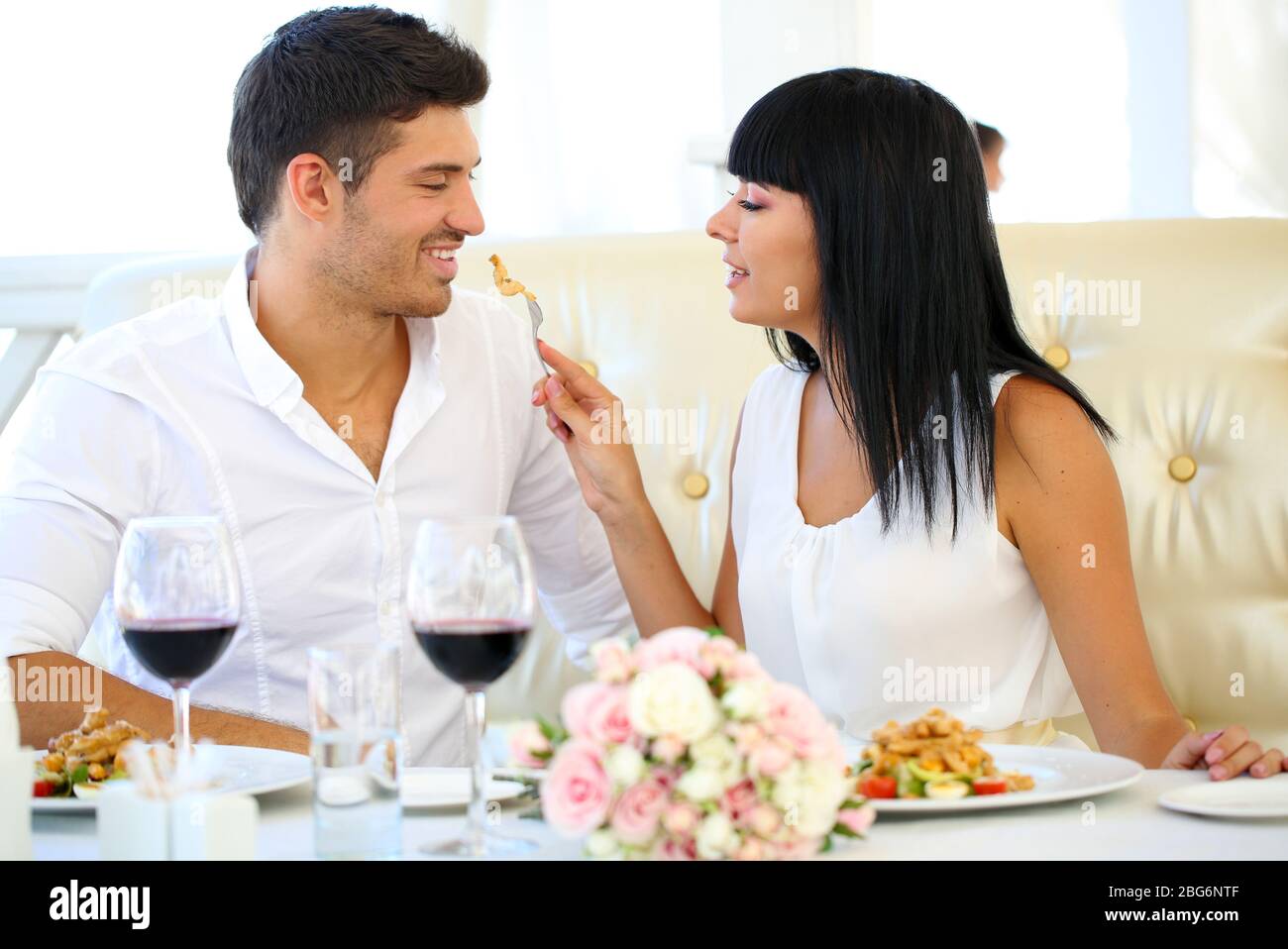 Beautiful couple having romantic dinner at restaurant Stock Photo - Alamy
