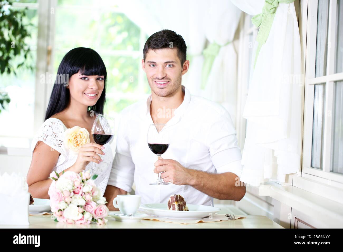 Beautiful couple having romantic dinner at restaurant Stock Photo - Alamy