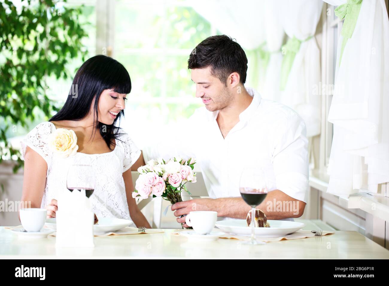 Beautiful couple having romantic dinner at restaurant Stock Photo - Alamy