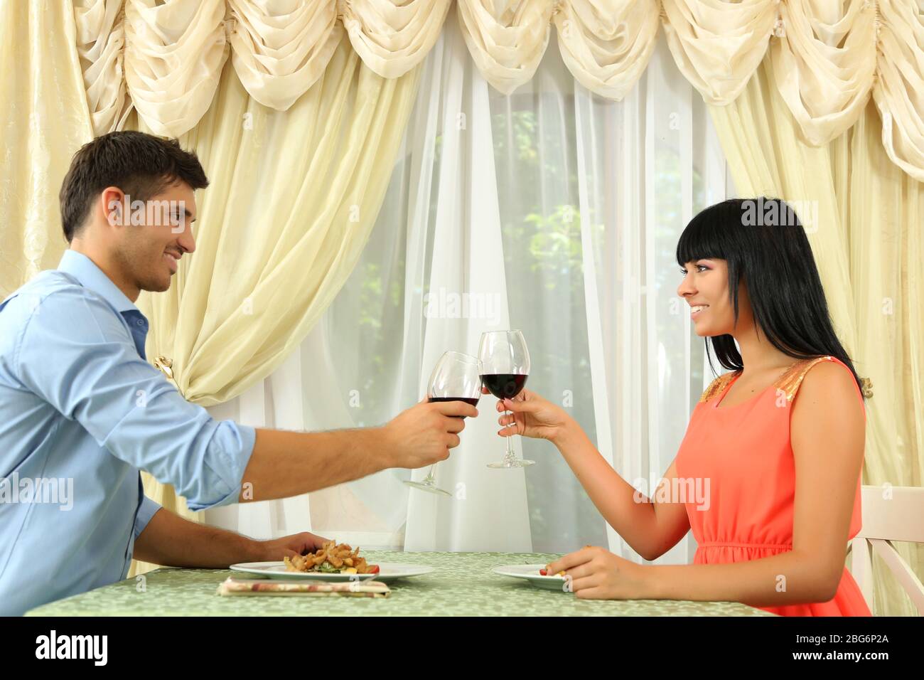 Beautiful couple having romantic dinner at restaurant Stock Photo - Alamy