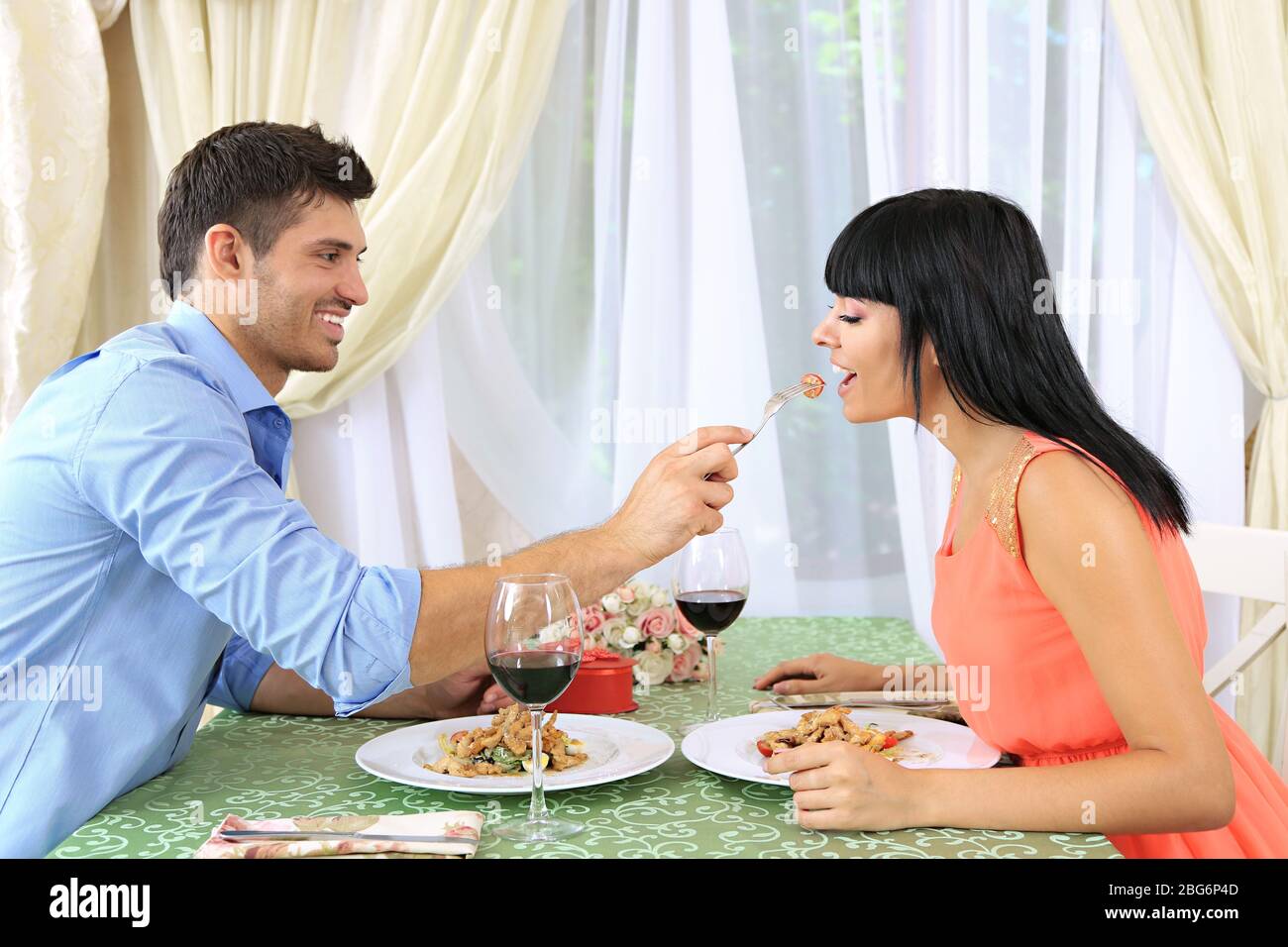 Beautiful couple having romantic dinner at restaurant Stock Photo - Alamy