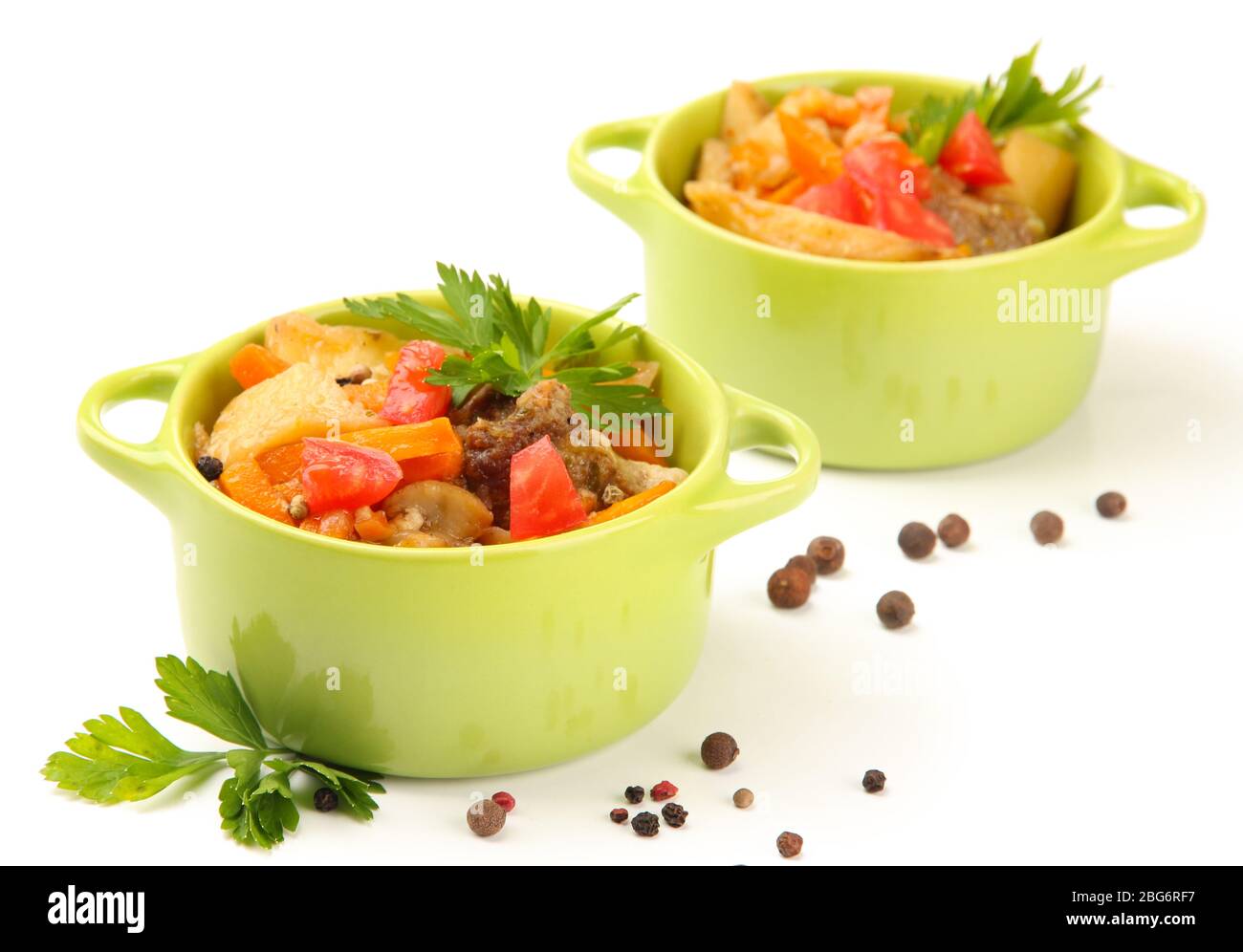 Homemade beef stir fry with vegetables in color pans, isolated on white ...