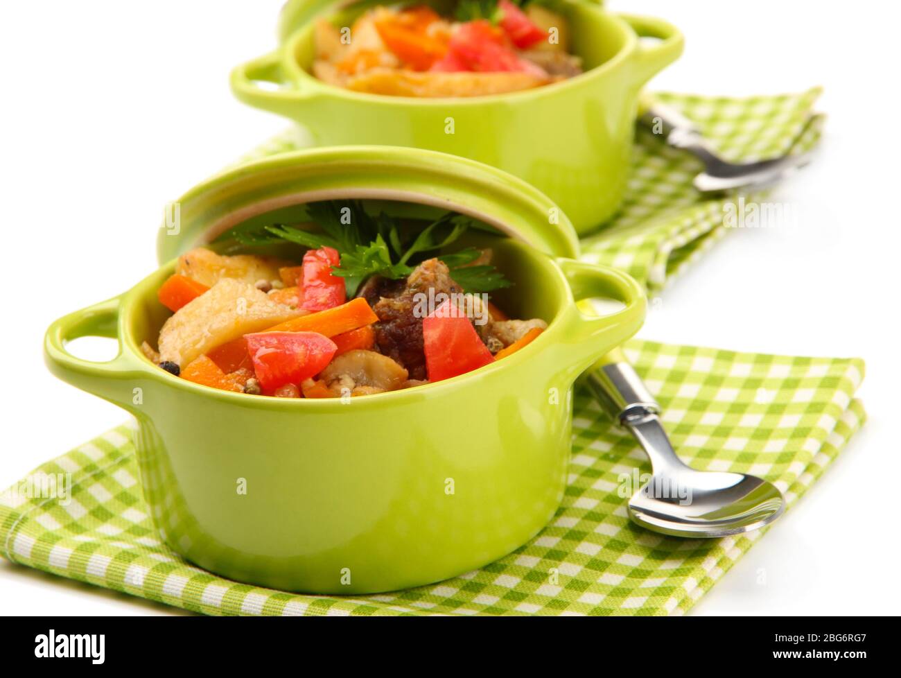 Homemade beef stir fry with vegetables in color pans, isolated on white ...