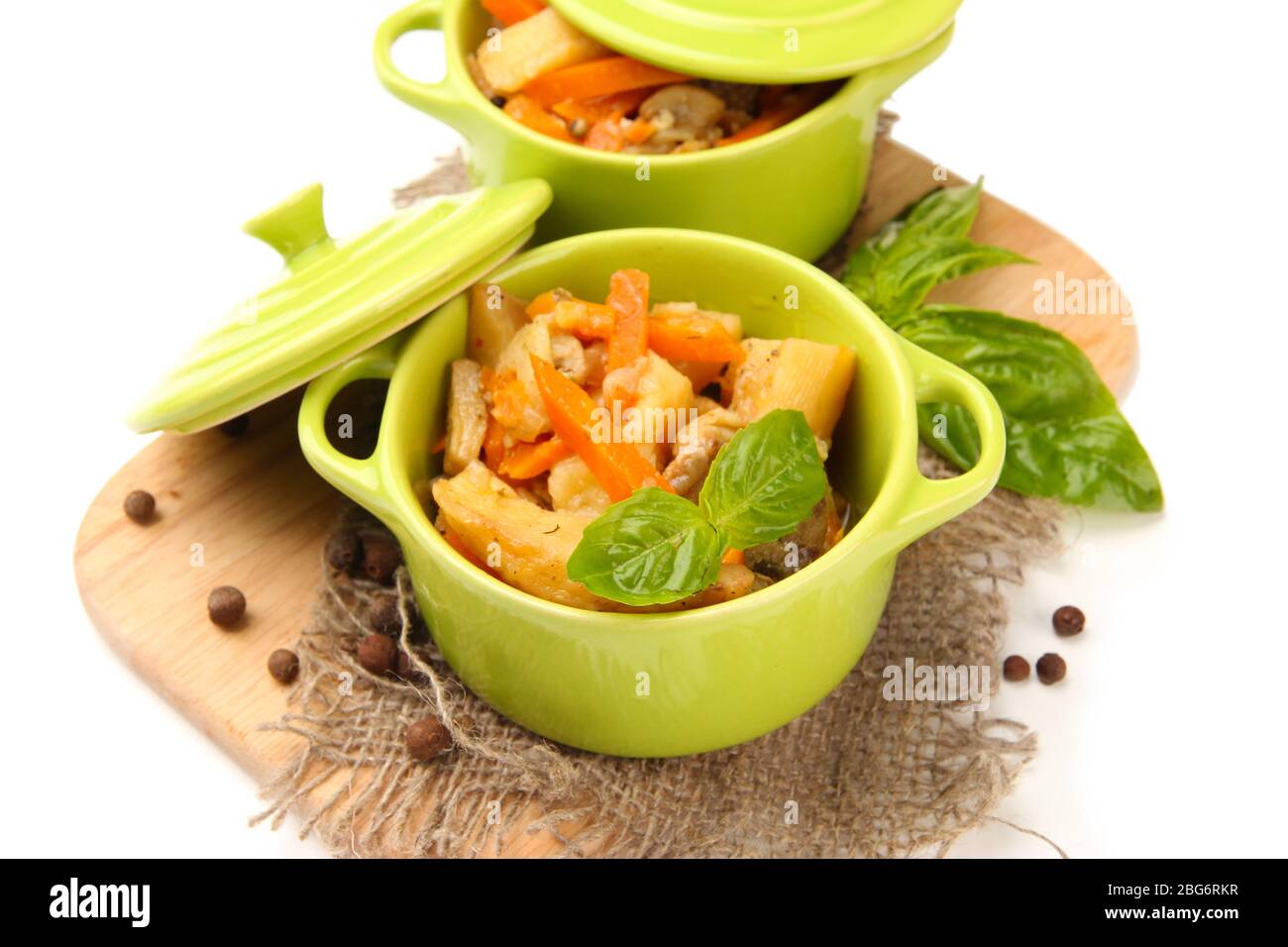 Homemade beef stir fry with vegetables in color pans, isolated on white ...