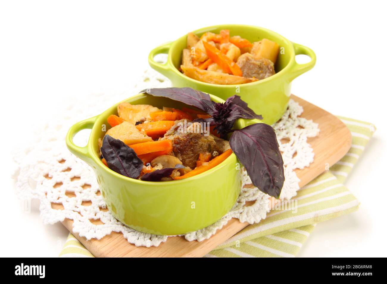 Homemade beef stir fry with vegetables in color pans, isolated on white ...