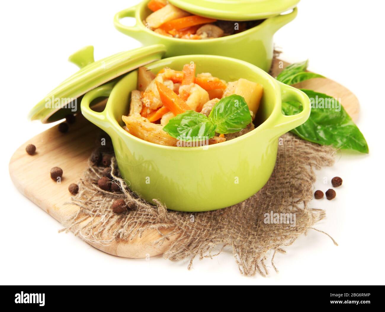 Homemade beef stir fry with vegetables in color pans, isolated on white ...