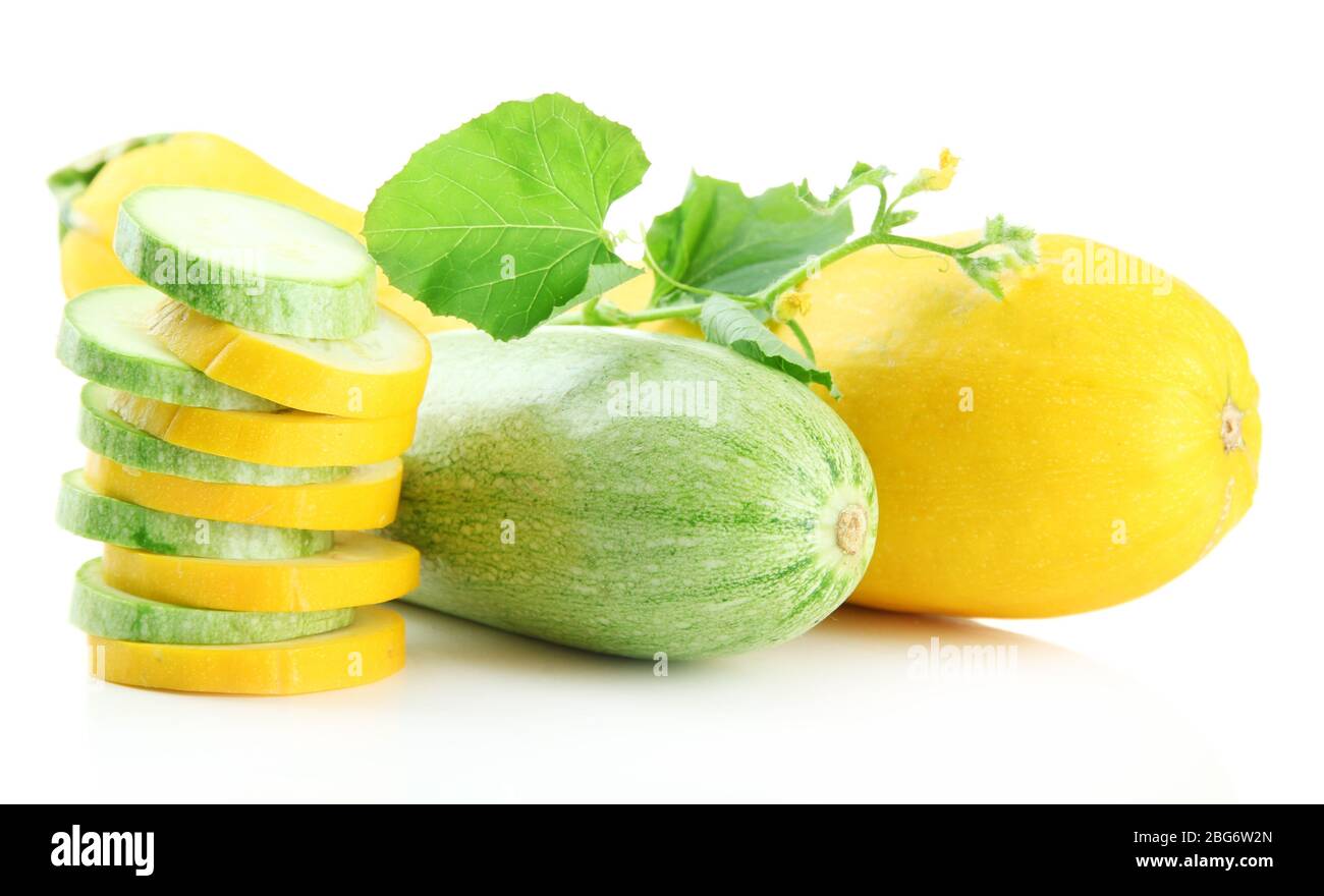 Sliced and whole raw zucchini, isolated on white Stock Photo - Alamy