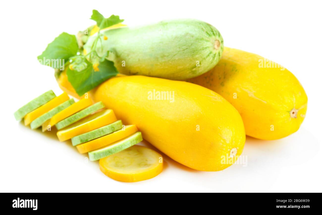 Sliced and whole raw zucchini, isolated on white Stock Photo - Alamy