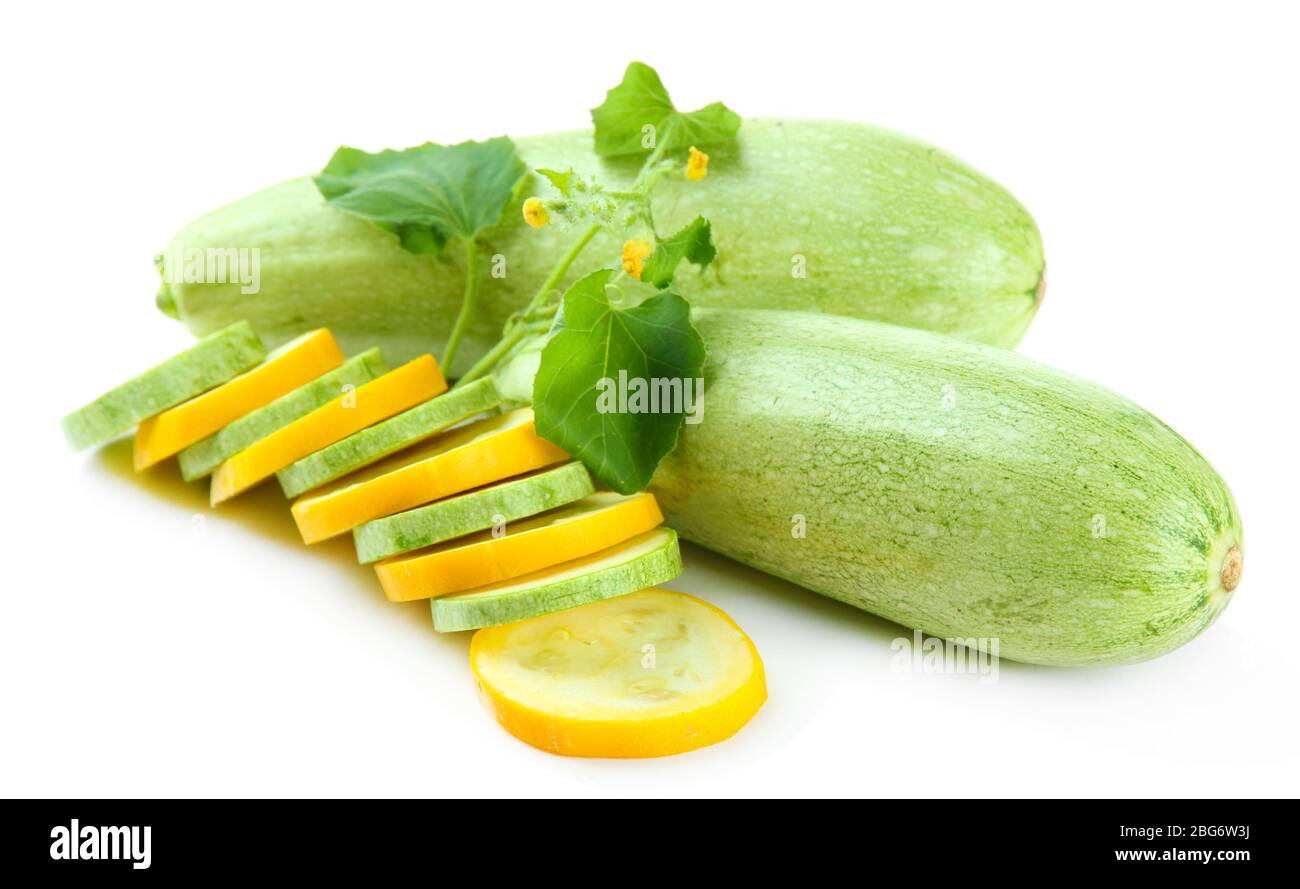 Sliced and whole raw zucchini, isolated on white Stock Photo - Alamy