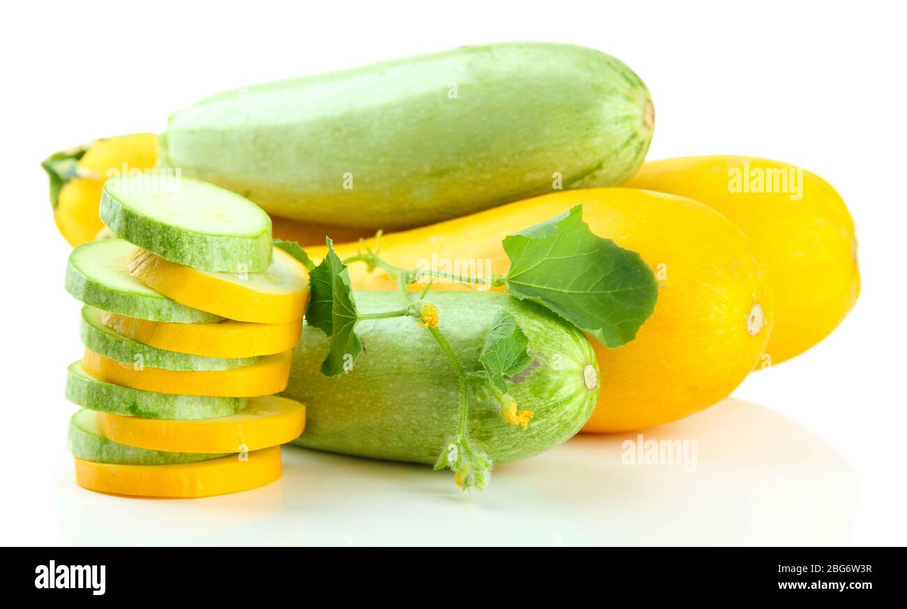 Sliced and whole raw zucchini, isolated on white Stock Photo - Alamy