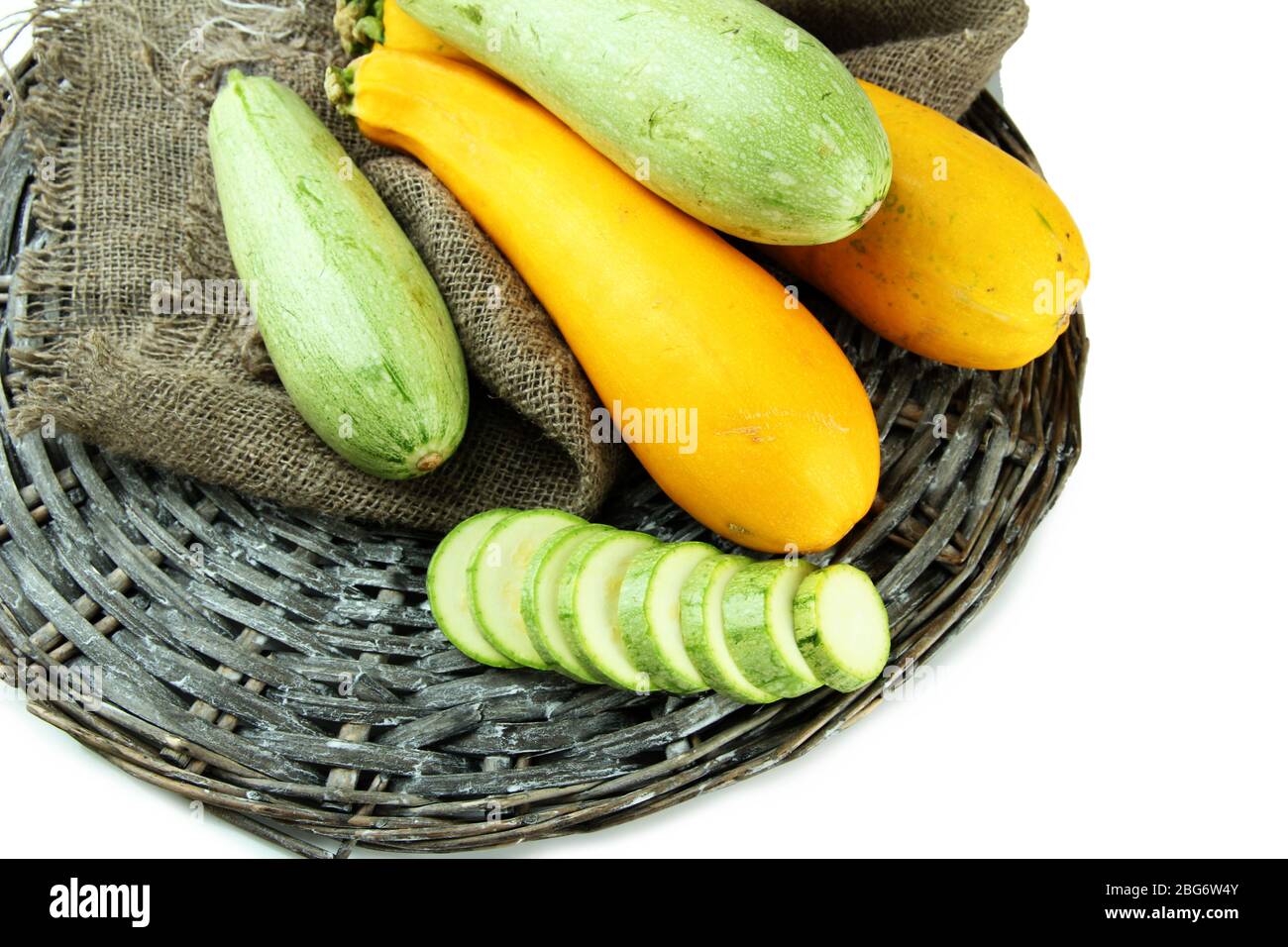 Sliced and whole raw zucchini, isolated on white Stock Photo - Alamy