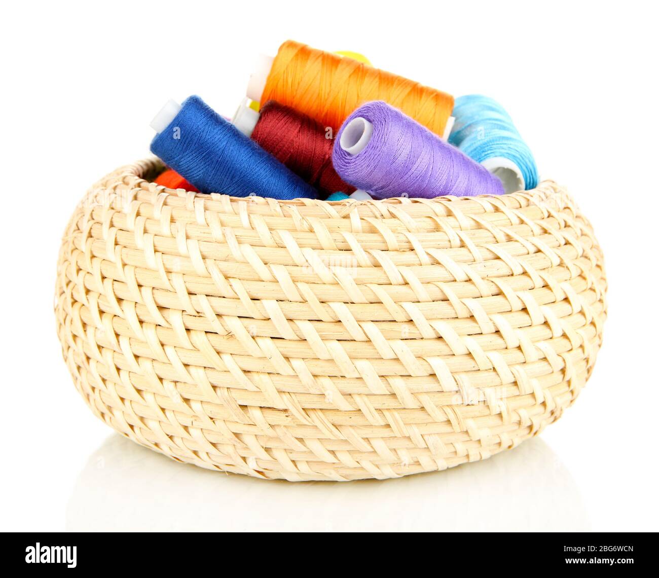 Wicker basket with accessories for needlework isolated on white Stock ...
