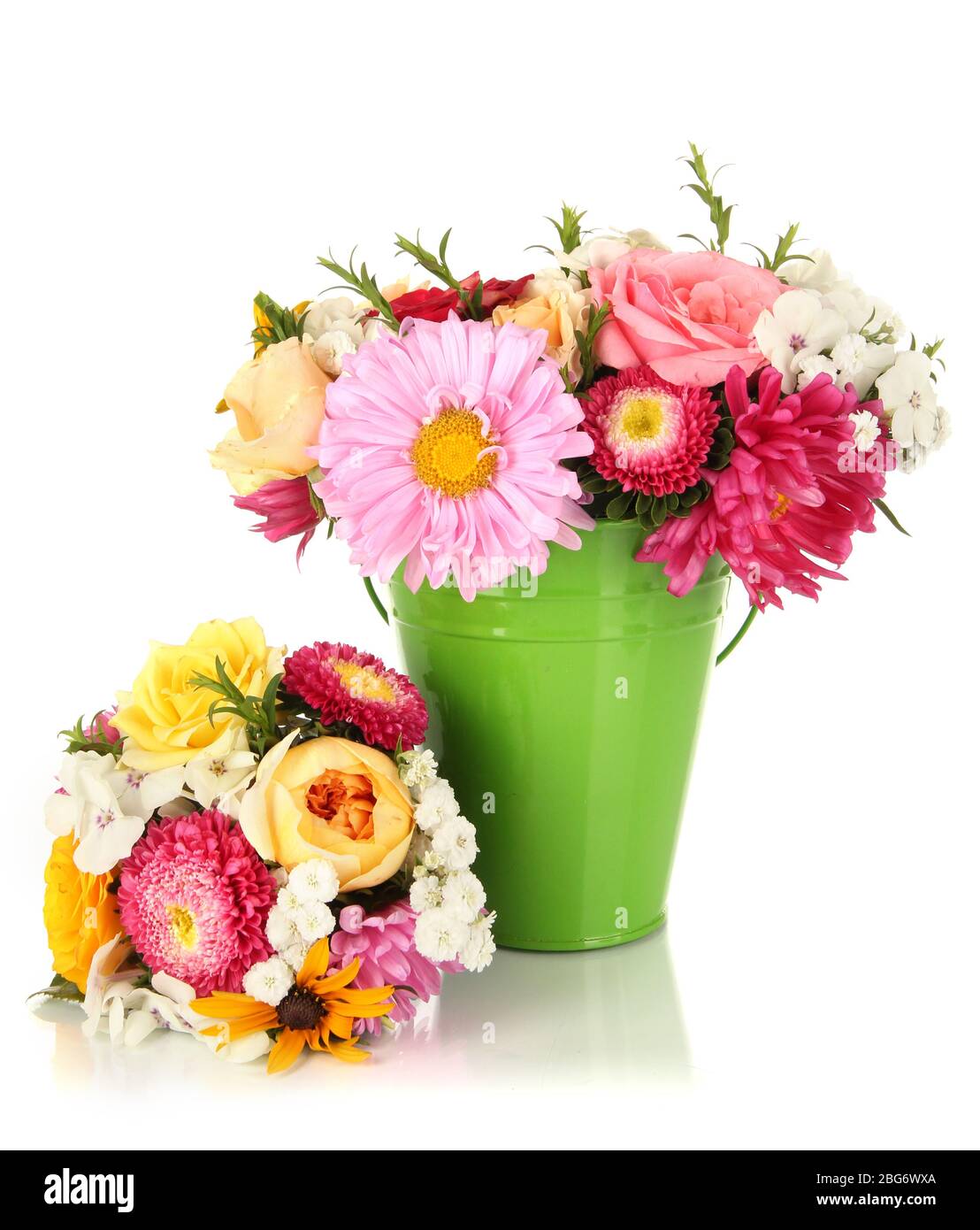Beautiful bouquet of bright flowers in color vase, isolated on white ...