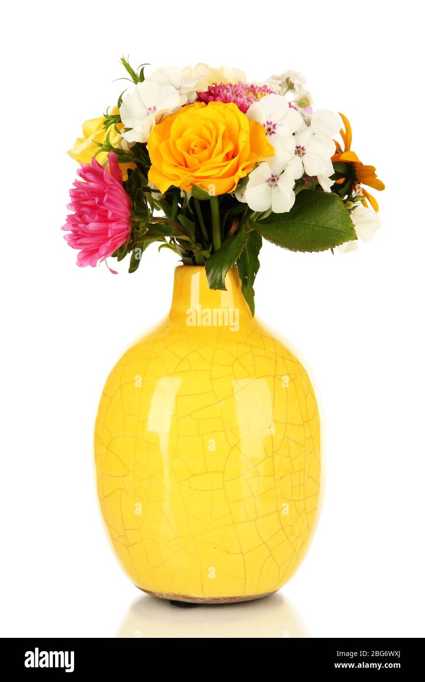 Beautiful bouquet of bright flowers in color vase, isolated on white ...