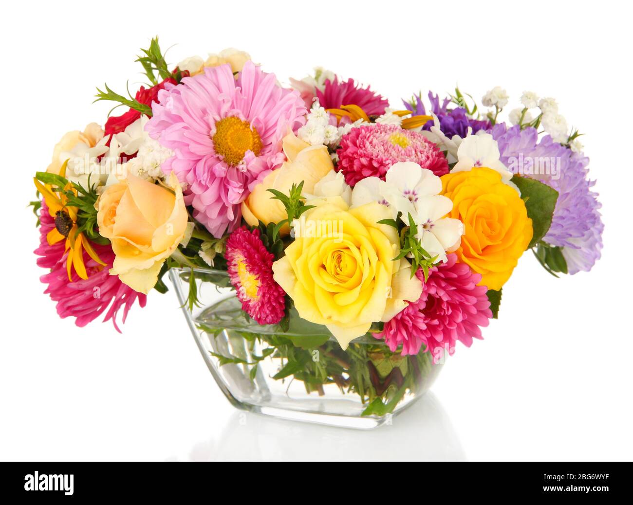 Beautiful bouquet of bright flowers in glass vase, isolated on white ...
