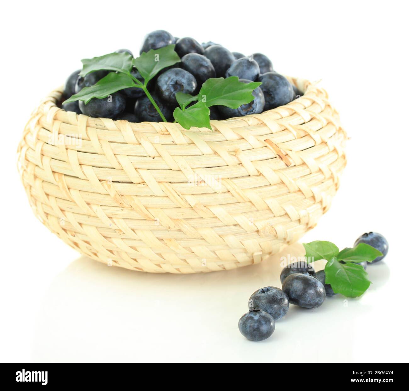 Blueberries in wooden basket isolated on white Stock Photo - Alamy
