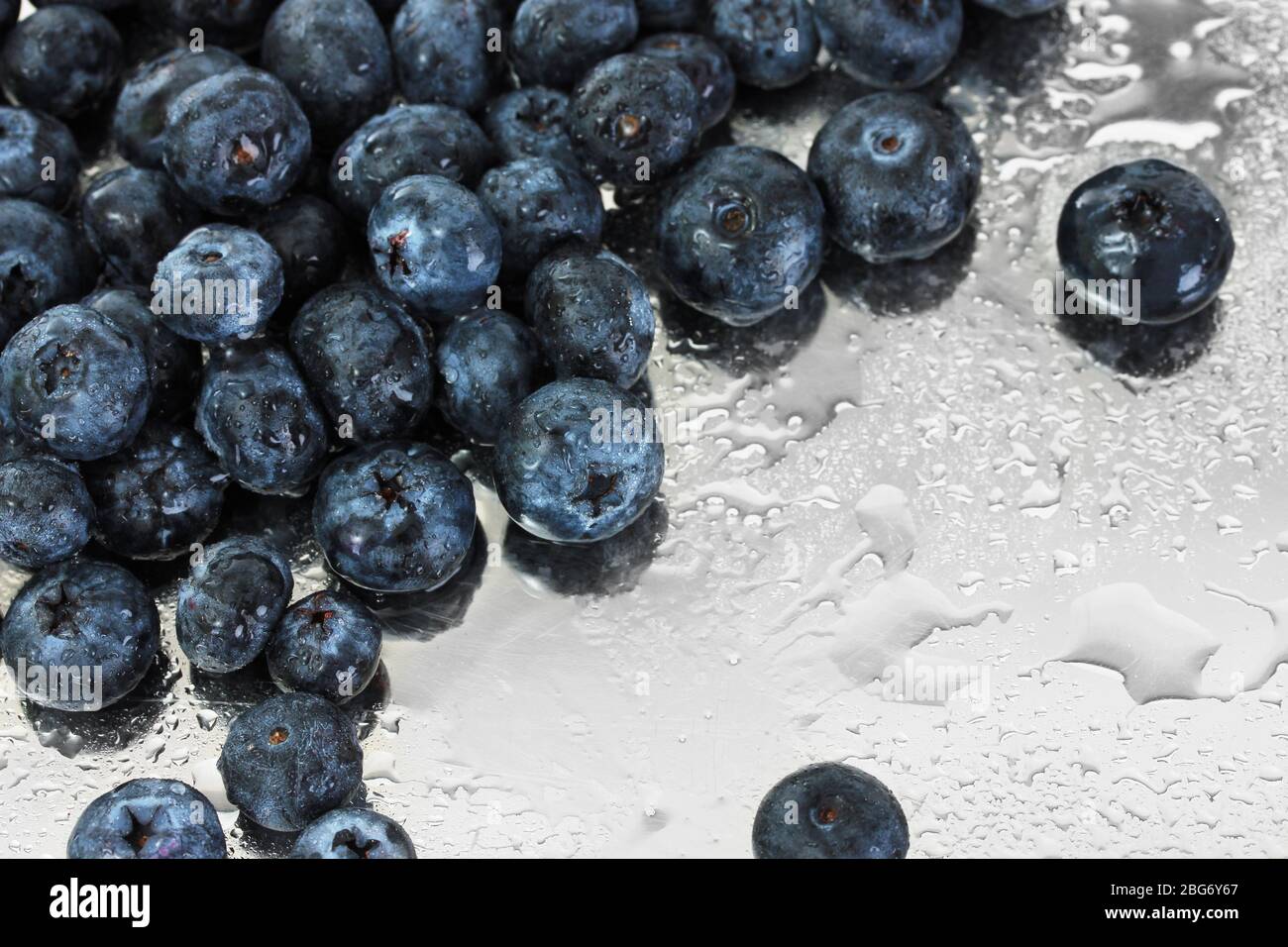 Blueberries on metal background Stock Photo - Alamy