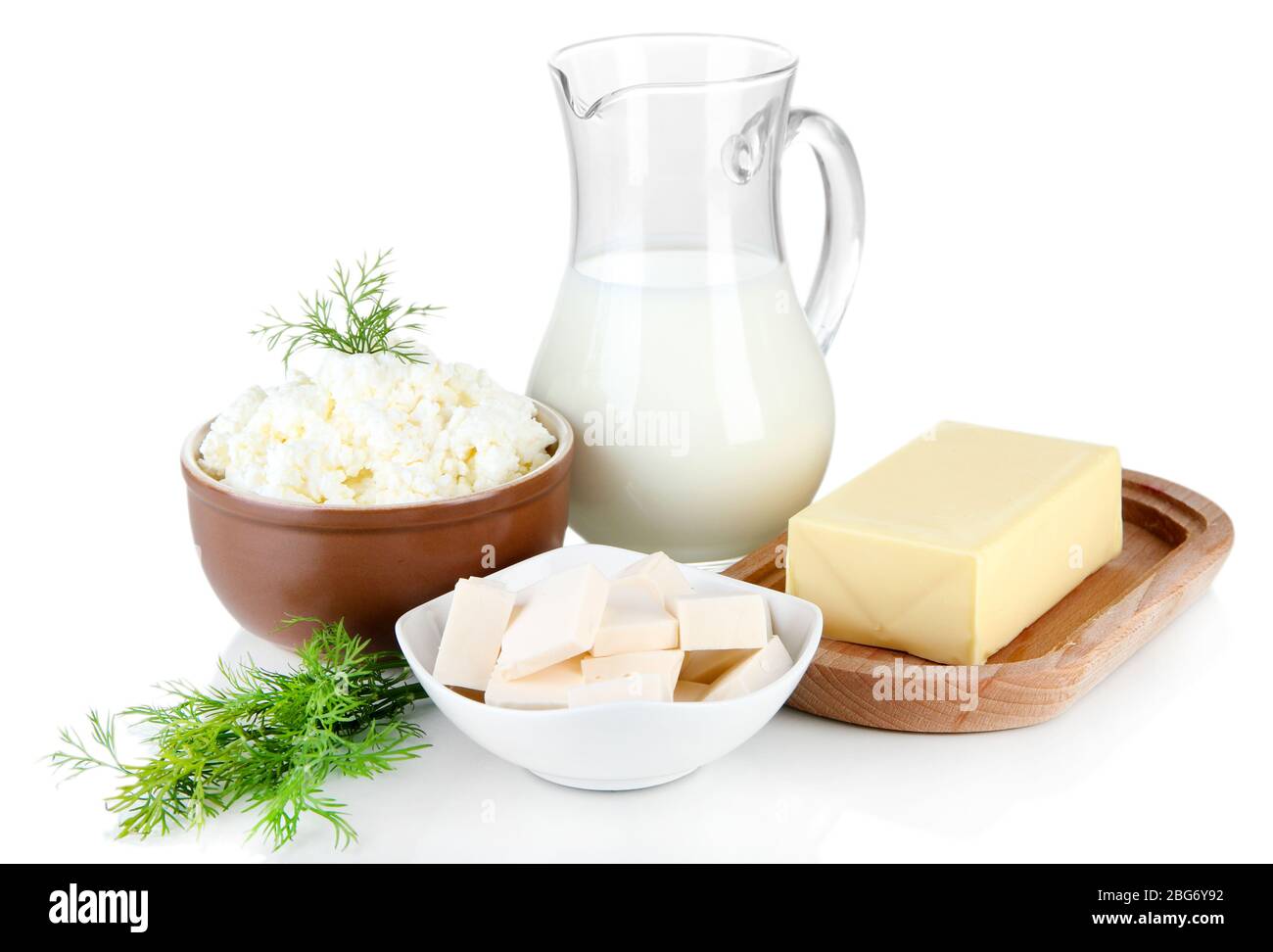 Fresh dairy products with greens isolated on white Stock Photo - Alamy