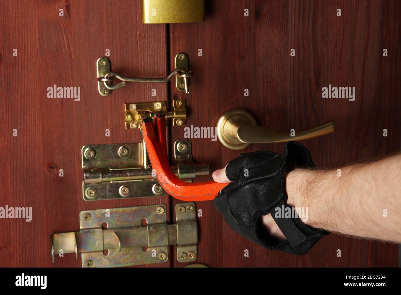 Robber breaks castle in door close-up Stock Photo - Alamy