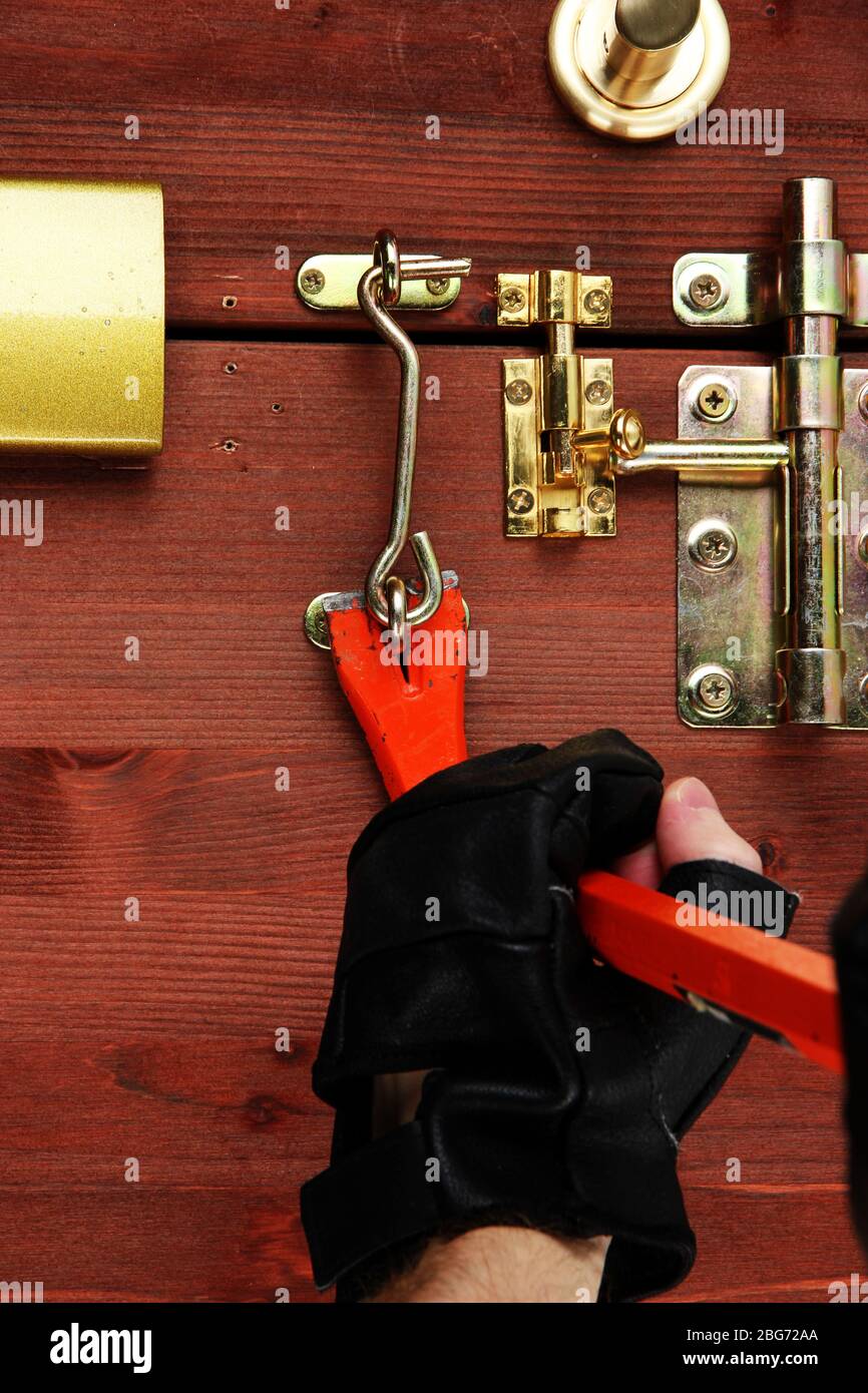 Robber breaks castle in door close-up Stock Photo - Alamy