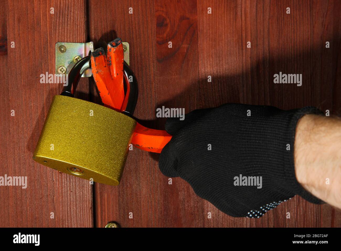 Robber breaks castle in door close-up Stock Photo - Alamy
