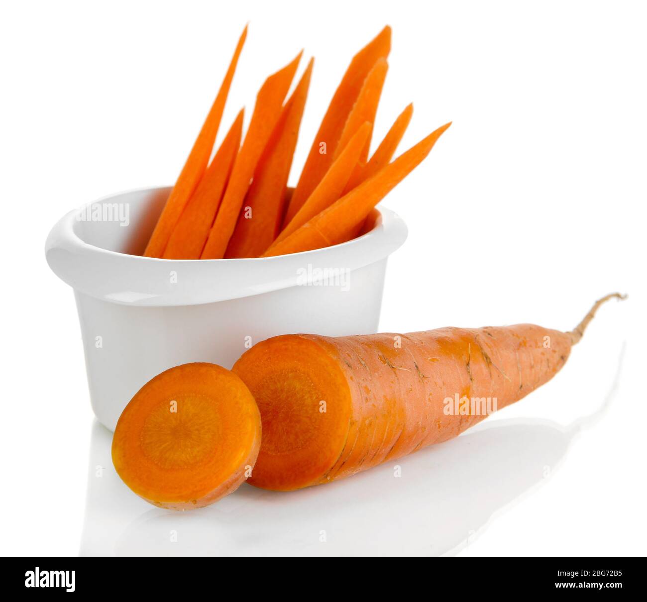 Bright fresh carrot cut up slices in bowl isolated on white Stock Photo ...