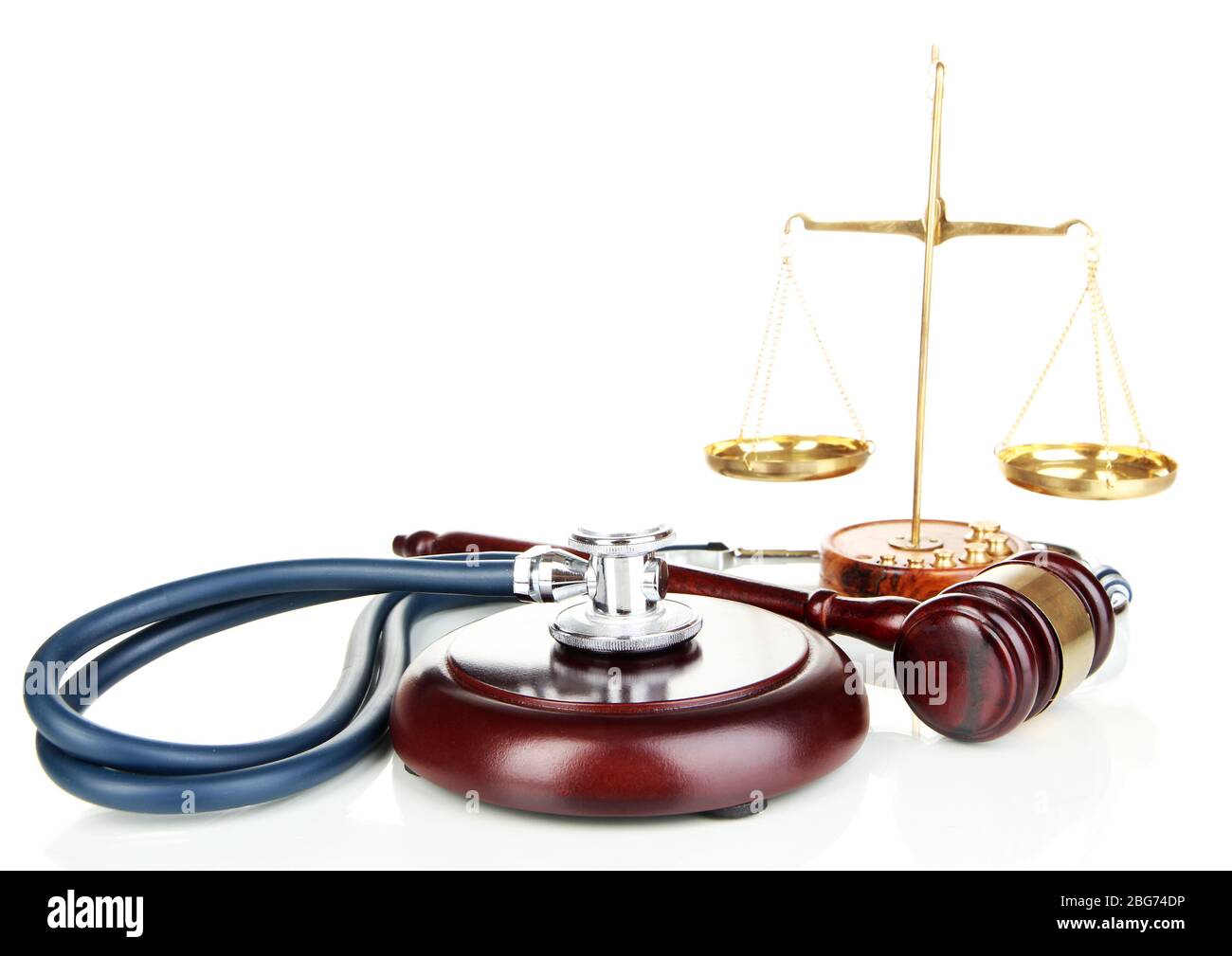 Medicine law concept. Gavel, scales and stethoscope isolated on white ...