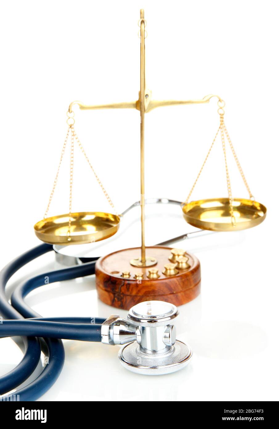 Medicine law concept. Gavel, scales and stethoscope isolated on white ...