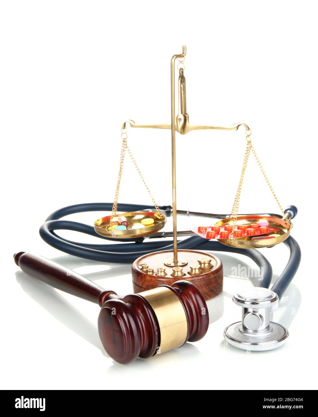 Medicine law concept. Gavel, scales and stethoscope isolated on white ...