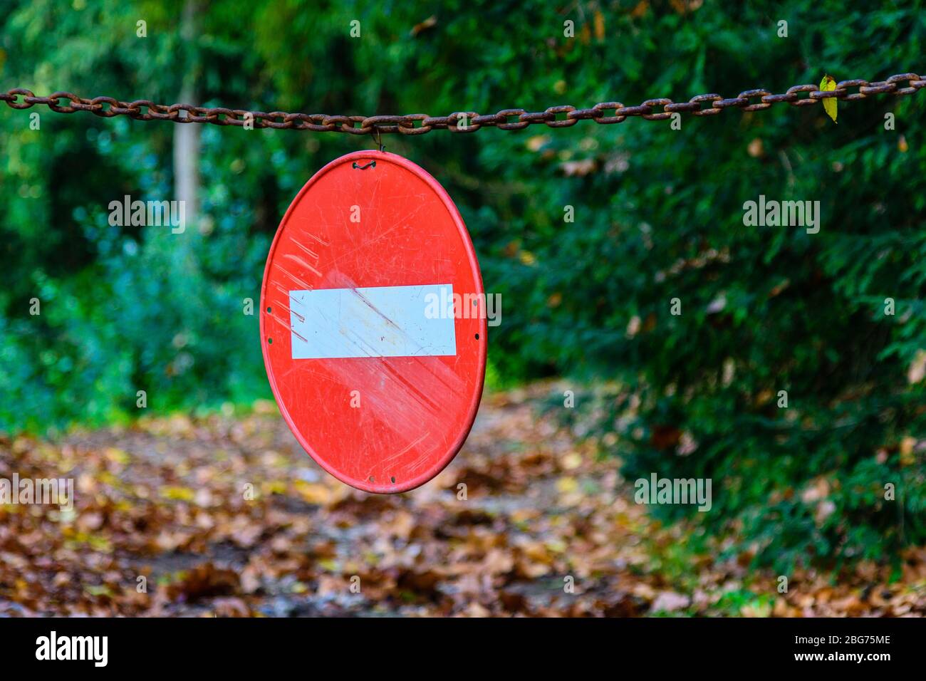Metal access warning sign hanging on a steel chain Stock Photo - Alamy