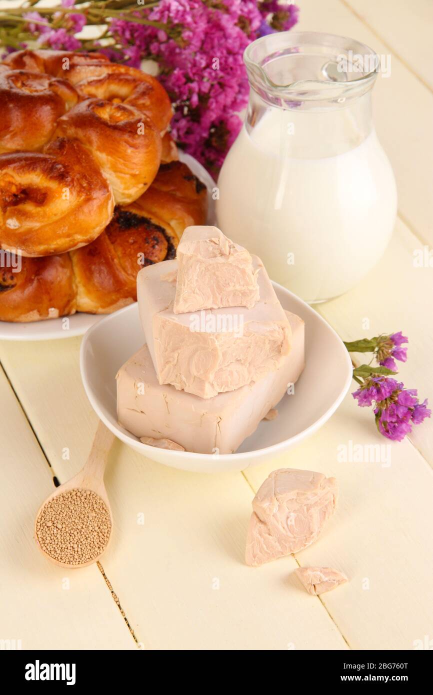 Dry yeast with pastry on wooden table close-up Stock Photo - Alamy