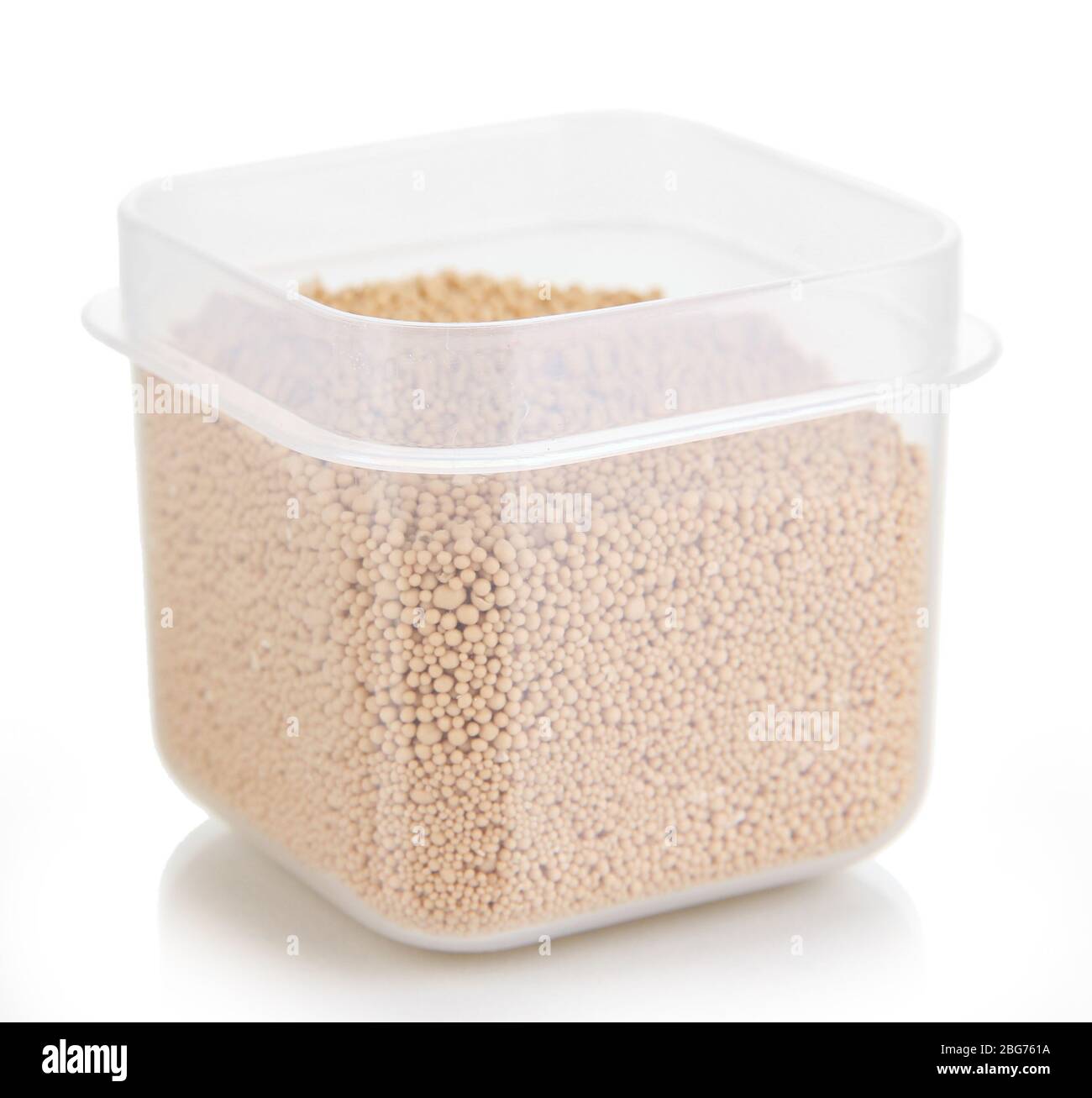 Dry yeast in container isolated on white Stock Photo - Alamy