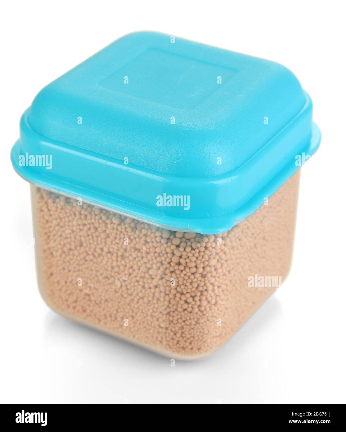 Dry yeast in container isolated on white Stock Photo - Alamy